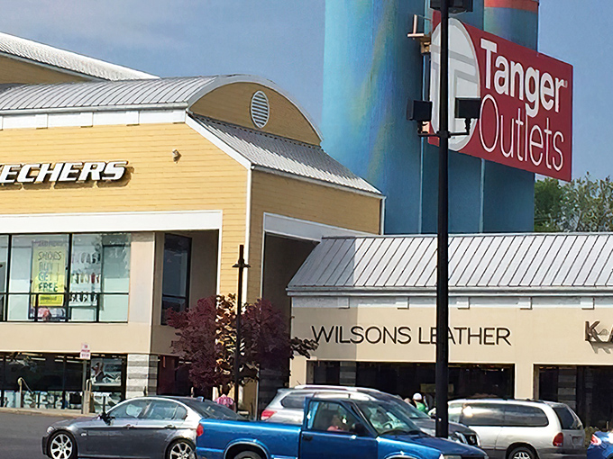 The iconic Tanger Outlets sign welcomes bargain hunters to a retail wonderland where wallets tremble but spirits soar.