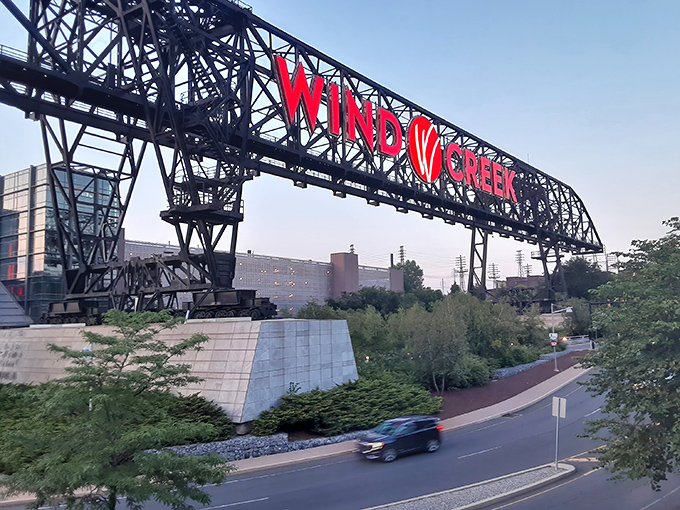 The iconic ore bridge structure with its bold red Wind Creek signage stands as a modern beacon for bargain hunters, bridging Bethlehem's industrial past with its retail present.
