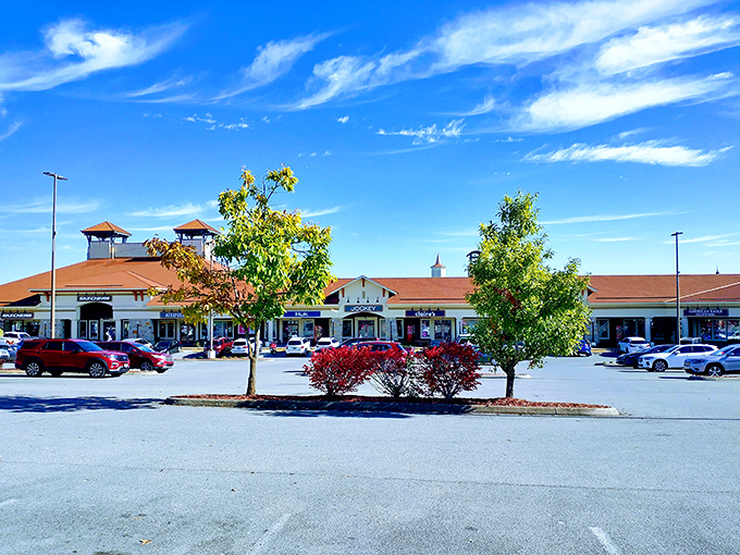 The colonial-style architecture of Tanger Outlets Sevierville stands proudly against Tennessee's blue skies, promising retail therapy with a side of Southern charm.
