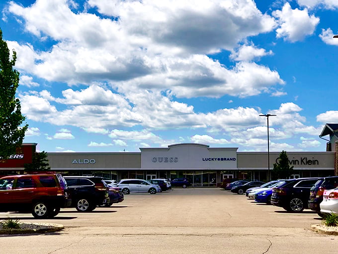 Blue skies and big brands &ndash; the GUESS, ALDO, and Calvin Klein storefronts stand ready for your wallet's workout session.