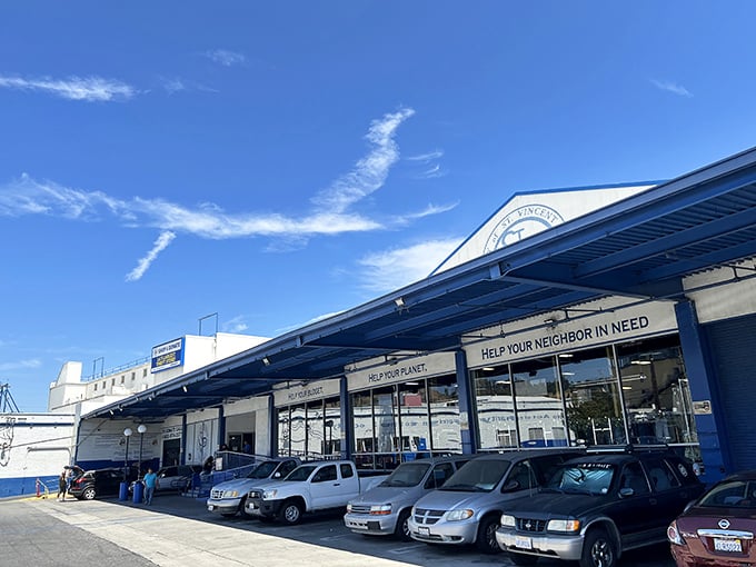 The blue-trimmed facade promises more than just shopping&mdash;it's an invitation to treasure hunting with purpose. "Help Your Planet. Help Your Neighbor in Need."