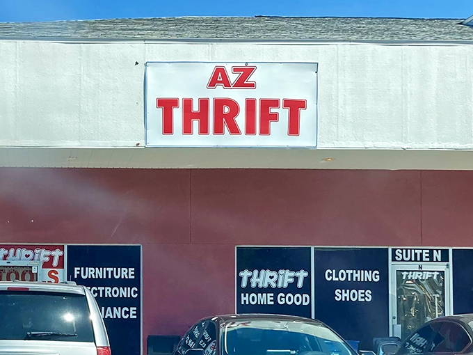 The bold red signage of AZ Thrift beckons bargain hunters like a lighthouse guiding ships to treasure-filled shores.