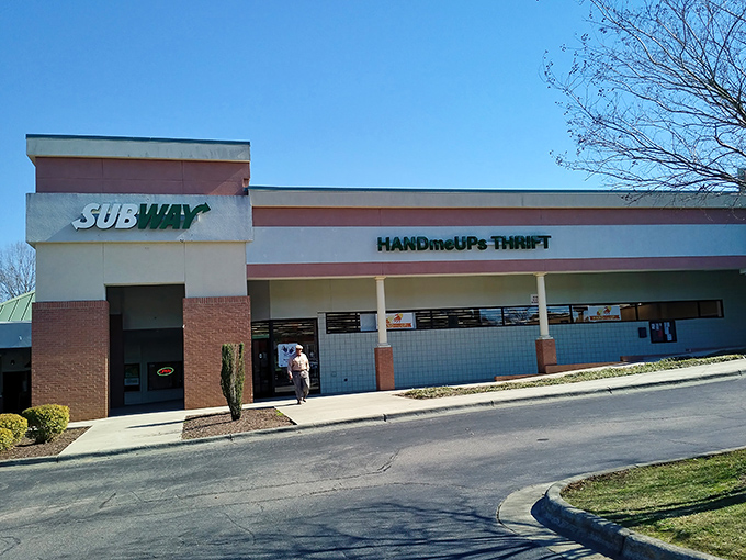 The unassuming storefront belies the wonderland within. Like a treasure chest disguised as a strip mall tenant, HandmeUPs Thrift awaits bargain hunters with open doors.