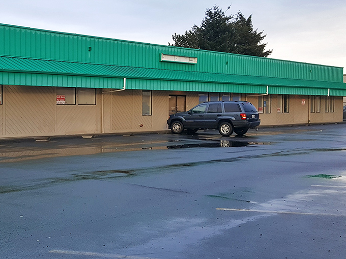 The distinctive teal exterior of Lancaster Flea Market beckons treasure hunters like a retail oasis in Salem's urban landscape.