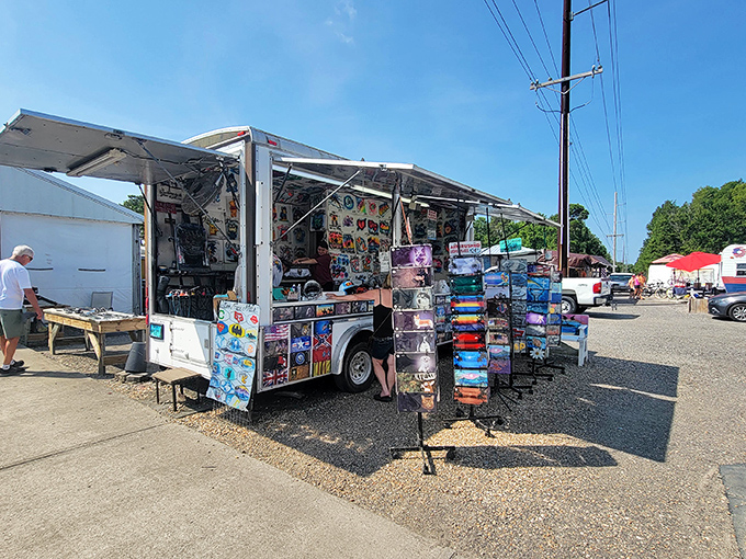 Outdoor vendors display colorful beach souvenirs under the Carolina sun, where treasure hunting begins at Hudson's Surfside Flea Market.