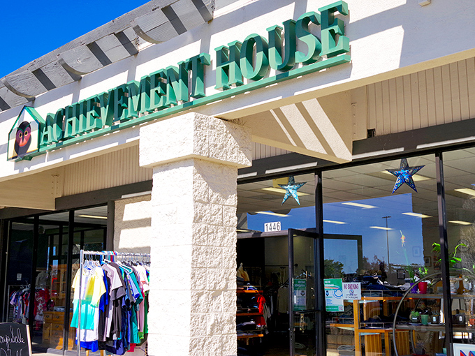 The welcoming storefront of Achievement House beckons with its cheerful owl logo&mdash;like a wise old friend inviting you to discover hidden treasures inside.
