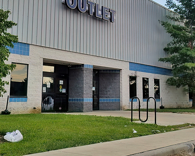 The unassuming exterior of Goodwill Outlet in New Castle – where treasure hunting adventures begin behind those modest blue-trimmed doors.