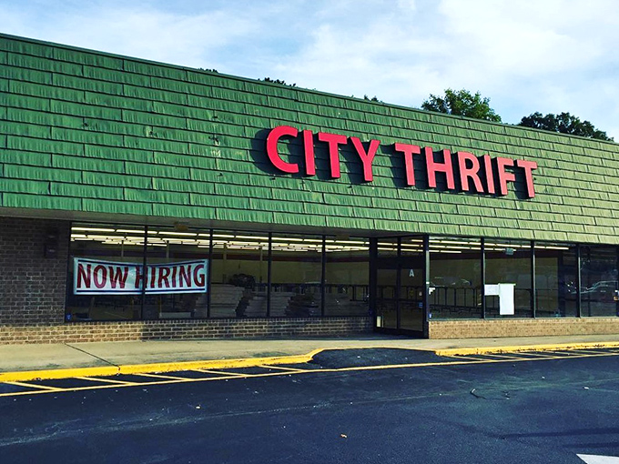 The bold red letters of City Thrift stand out like a beacon of bargain hope against the dark exterior, promising treasures within.