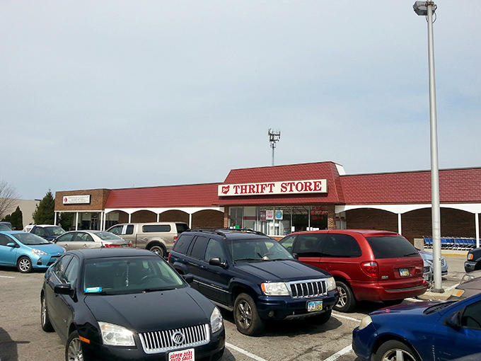 The iconic red-roofed Ohio Thrift Store stands ready for treasure hunters, its parking lot filled with cars of fellow bargain adventurers.
