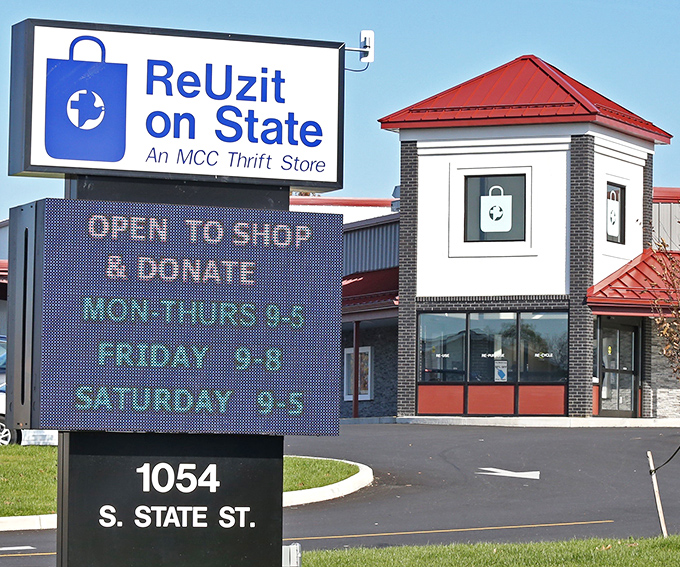 The iconic blue and white sign of ReUzit on State stands like a beacon for bargain hunters, promising treasures within its walls at 1054 S. State Street.