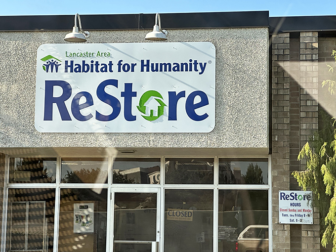 The blue and green sign welcomes bargain hunters to Lancaster's ReStore, where one person's donations become another's affordable treasures.