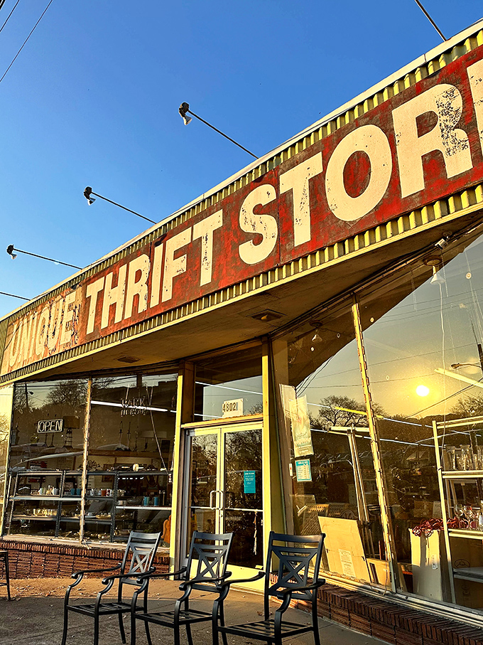 Bathed in golden hour light, the iconic Unique Thrift Store sign stands as a beacon to Nashville's most savvy shoppers and nostalgic collectors.