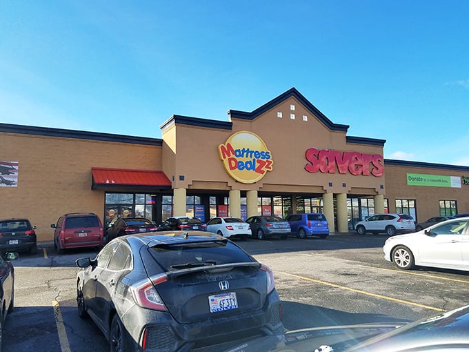 The beige facade of Savers beckons like a siren call to thrift enthusiasts, promising treasures within its unassuming exterior.