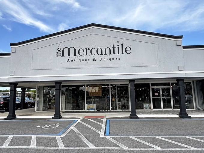 The elegant storefront welcomes treasure hunters with classic columns and a promise of "Antiques & Uniques"&mdash;an understatement if there ever was one.
