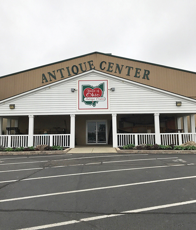 The welcoming facade of Heart of Ohio Antique Center stands proudly against blue Ohio skies, promising treasures within its unassuming exterior.