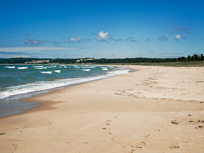 Crystal-clear waters meet golden sand at Peterson Road Beach, where Lake Michigan reveals its Caribbean-like beauty without the passport requirement.