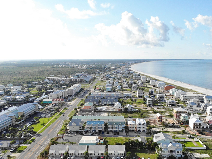 Aerial view of Mexico Beach showcasing its perfect crescent shoreline and charming coastal community. Old Florida at its finest!
