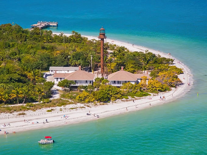 Sanibel's iconic lighthouse stands sentinel on the eastern tip, where turquoise waters meet pristine beaches. Nature's perfect postcard moment.
