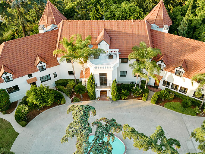 A bird's-eye view of Wrensmoor Castle reveals its fairy tale charm&mdash;twin turrets standing like sentinels while palm trees remind you this European fantasy exists in sunny California.