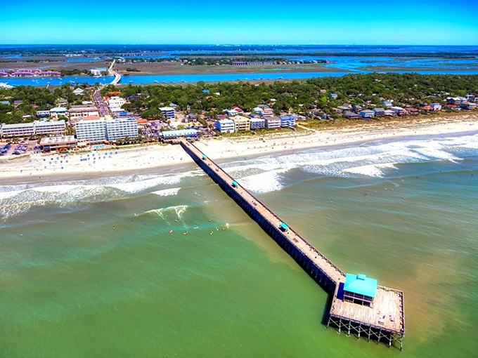 The iconic pier stretches into turquoise waters like nature's welcome mat, inviting you to leave your worries on the mainland.