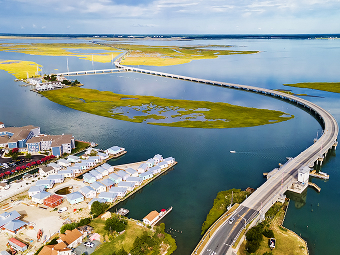 The gateway to tranquility: Chincoteague's iconic causeway stretches across shimmering waters, promising an escape where time slows and worries dissolve into the coastal breeze.