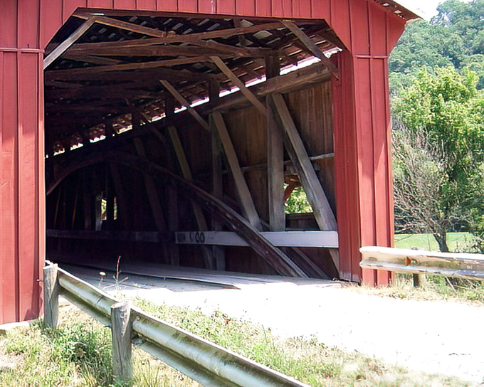 The crimson gateway to yesterday stands proudly in Stockport, its weathered beams inviting travelers to step back in time.