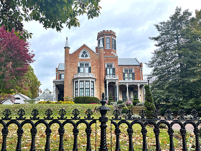 The red brick fa&ccedil;ade and distinctive tower of The Castle stand proudly behind wrought iron fencing, like a Victorian dream that somehow materialized in small-town Ohio.