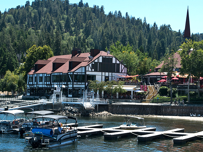 The quintessential Lake Arrowhead view&mdash;Tudor-style buildings nestled against emerald pines with that impossibly blue water. Mother Nature showing off again.