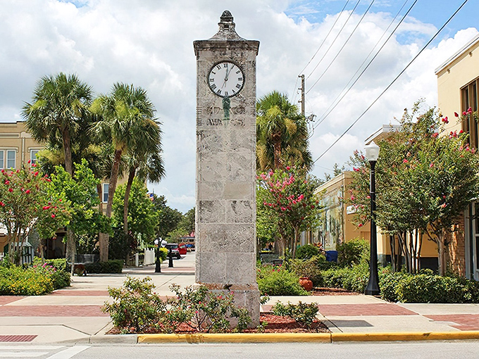 Lake Wales' historic clock tower stands like a dignified timekeeper, surrounded by palm trees and flowering shrubs that seem to be showing off just a little.