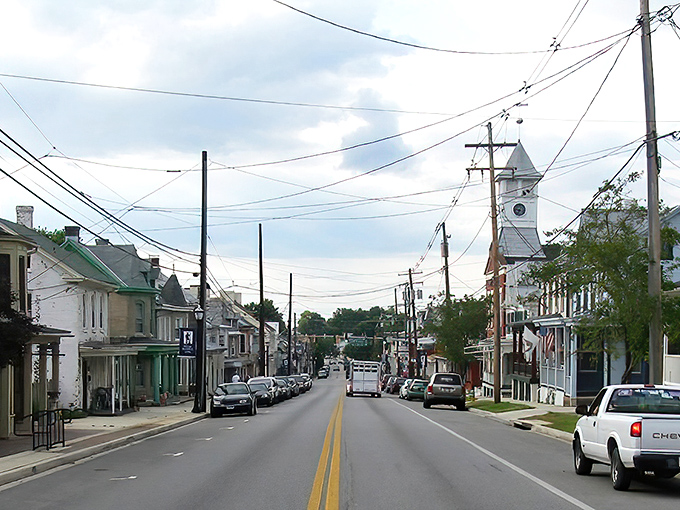 Main Street stretches before you like a Norman Rockwell painting come to life, complete with that iconic church steeple watching over daily life.