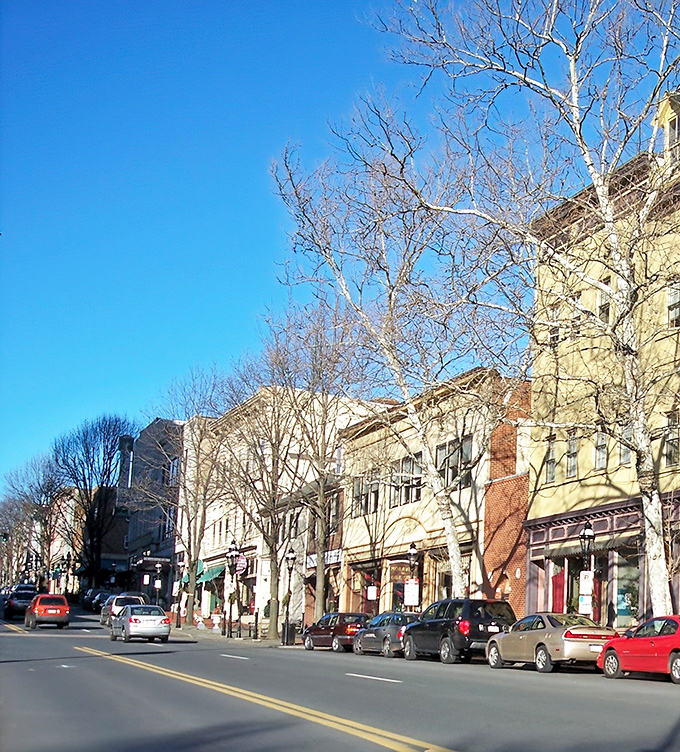 Main Street Bethlehem stretches before you like a Norman Rockwell painting come to life, where historic architecture meets modern charm under impossibly blue Pennsylvania skies.