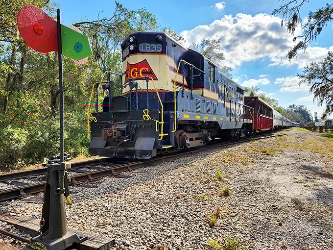 The classic passenger car of the Florida Railroad Museum stands proudly against a backdrop of Florida greenery, promising adventures on steel rails.