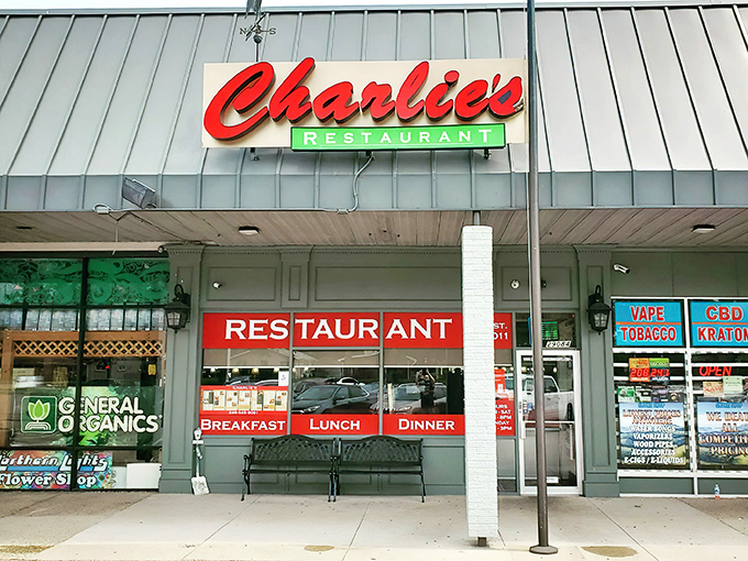 The iconic red script of Charlie's Restaurant beckons hungry travelers like a culinary lighthouse in this Madison Heights strip mall.