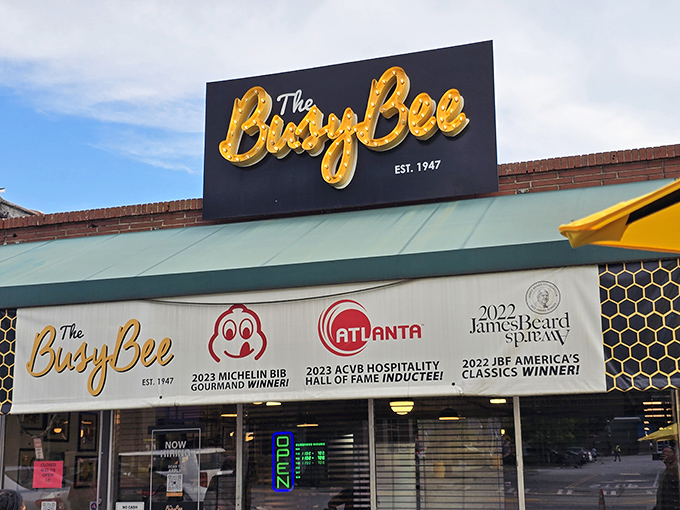 The unassuming brick exterior of Busy Bee Cafe hides Atlanta's soul food treasure. Yellow bollards stand guard like sentinels protecting culinary gold.