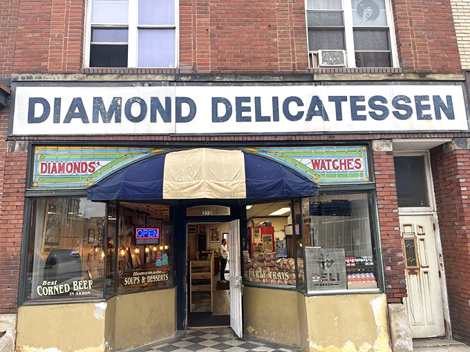 The brick facade of Diamond Deli stands proudly on Akron's South Main Street, its vintage sign and blue awning like a beacon for sandwich enthusiasts seeking culinary salvation.