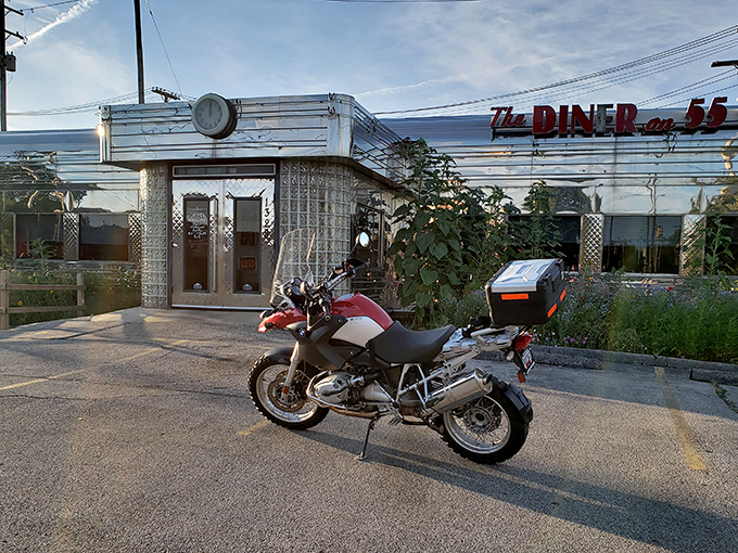 The gleaming stainless steel exterior of The Diner on 55th stands like a time capsule under the Cleveland sky, beckoning hungry travelers with its classic Americana charm.