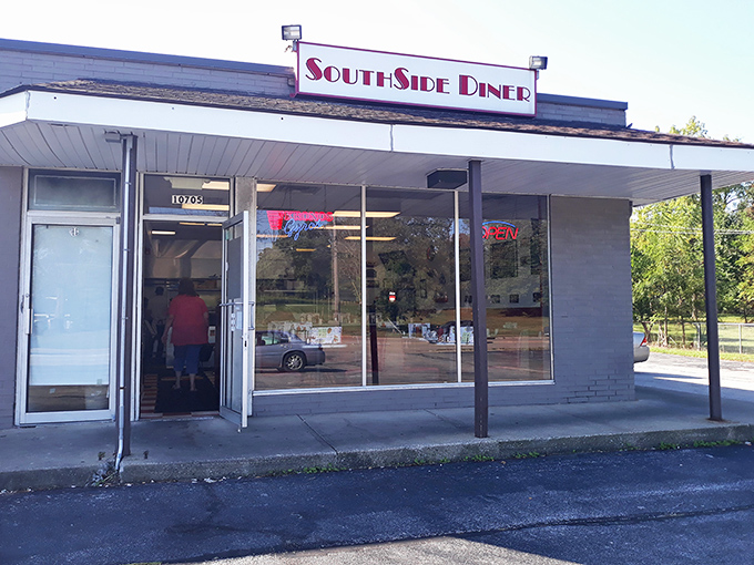 The unassuming exterior of Southside Diner stands like a culinary lighthouse in Parma, beckoning hungry travelers with its simple red signage and promise of comfort.