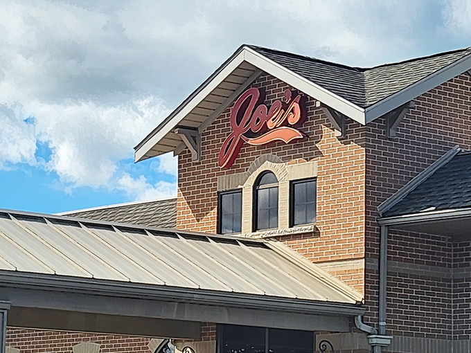 The welcoming brick exterior of Joe's Deli promises culinary treasures within. That red sign might as well say "Sandwich Paradise Ahead."