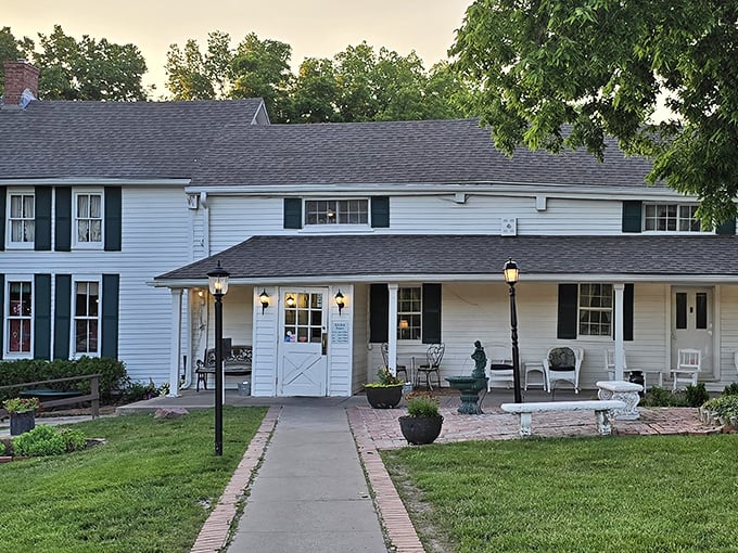 The white farmhouse exterior of Stroud's Oak Ridge Manor welcomes you like an old friend, promising comfort and satisfaction before you even step inside.