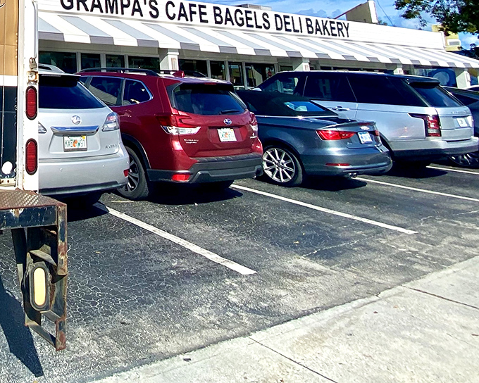 The classic striped awning of Grampa's beckons like a lighthouse for hungry souls seeking authentic deli salvation in Dania Beach.