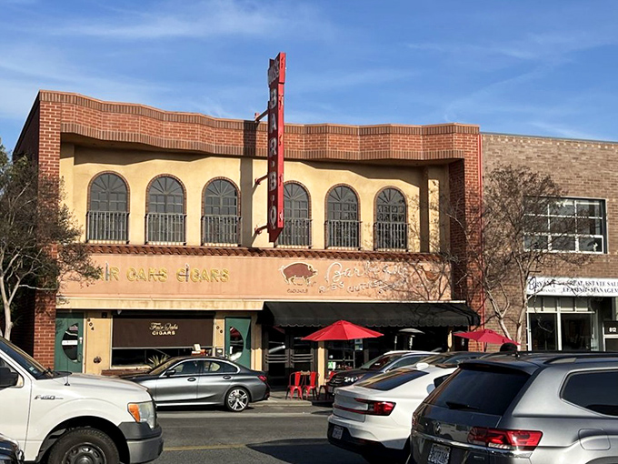 Brick and stucco charm with a side of outdoor seating. Gus's BBQ's distinctive fa&ccedil;ade has become a beloved landmark on Fair Oaks Avenue.