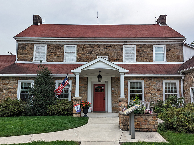 The historic Johnston House stands proudly along the Lincoln Highway, its sturdy stone walls and red roof welcoming travelers just as it did a century ago.