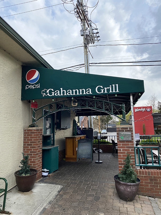 The unassuming green awning of Gahanna Grill beckons like an old friend. No pretension here—just the promise of burger perfection waiting inside.