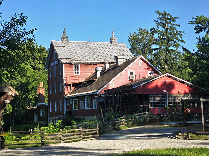 The bright red exterior of Clifton Mill stands like a cheerful sentinel of flavor, promising comfort food that'll make your taste buds do a happy dance.