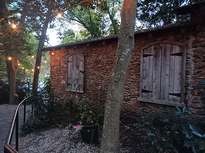 Nestled among towering trees, The Peddler's rustic stone exterior feels like discovering a secret woodland steakhouse. String lights add a touch of magic to this meat-lover's hideaway.
