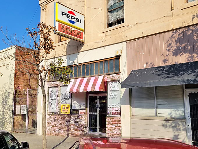 The unassuming exterior of Chef Paul's Cafe proves once again that culinary treasures often hide behind the simplest facades. That red and white awning? A beacon for those in the know.