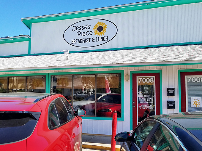 
The unassuming exterior of Jesse's Place, with its cheerful teal trim and sunflower logo, stands as a beacon for breakfast enthusiasts seeking authenticity over flash. 