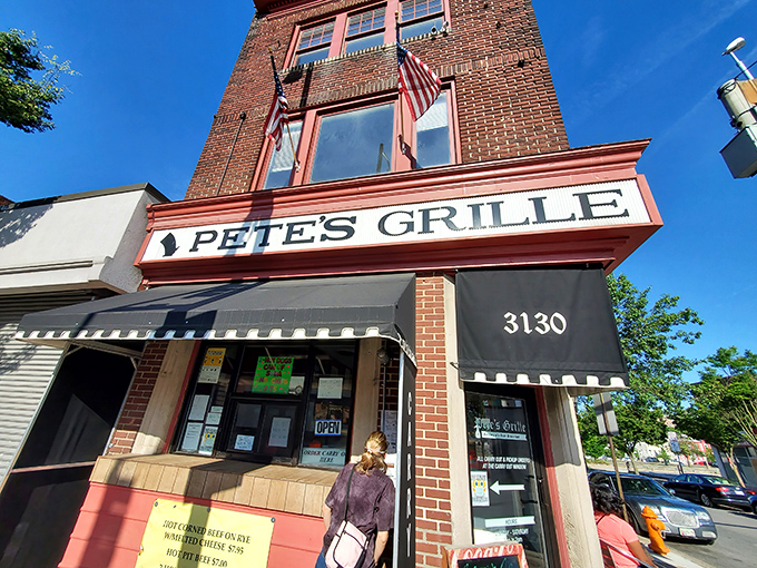 The unassuming corner spot that houses Pete's Grille stands like a beacon of breakfast hope on Greenmount Avenue. No fancy frills, just the promise of honest-to-goodness food inside.