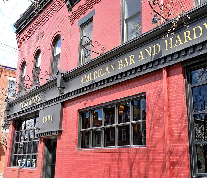The iconic red brick facade of Tessaro's stands proudly on Liberty Avenue, a beacon for burger enthusiasts since before Instagram made food famous.