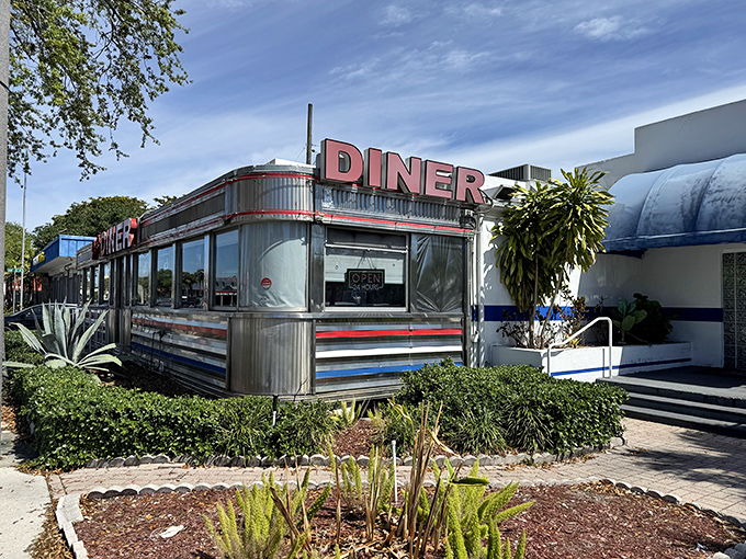 Chrome gleaming in the sunshine, this stainless steel beauty has been serving Hollywood comfort food longer than most Florida tans have lasted.